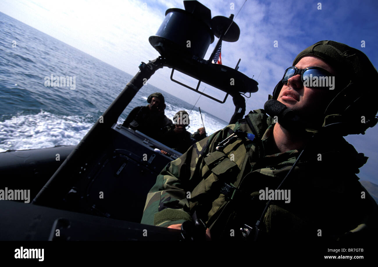Man in training aiming the forward gun on an inflatable boat in San ...