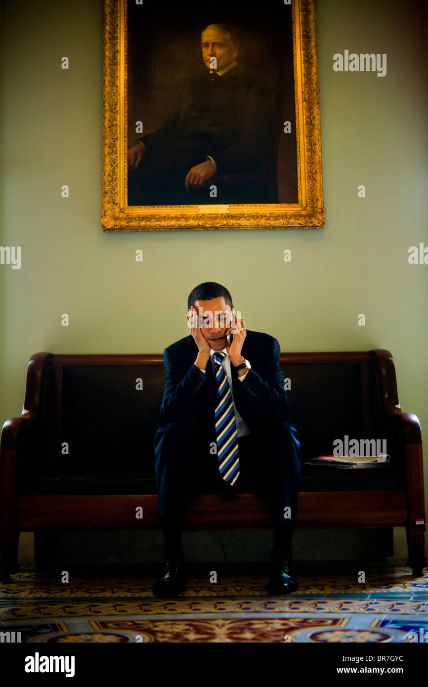 Barack Obama talks on a cell phone outside the Senate chambers of the U ...