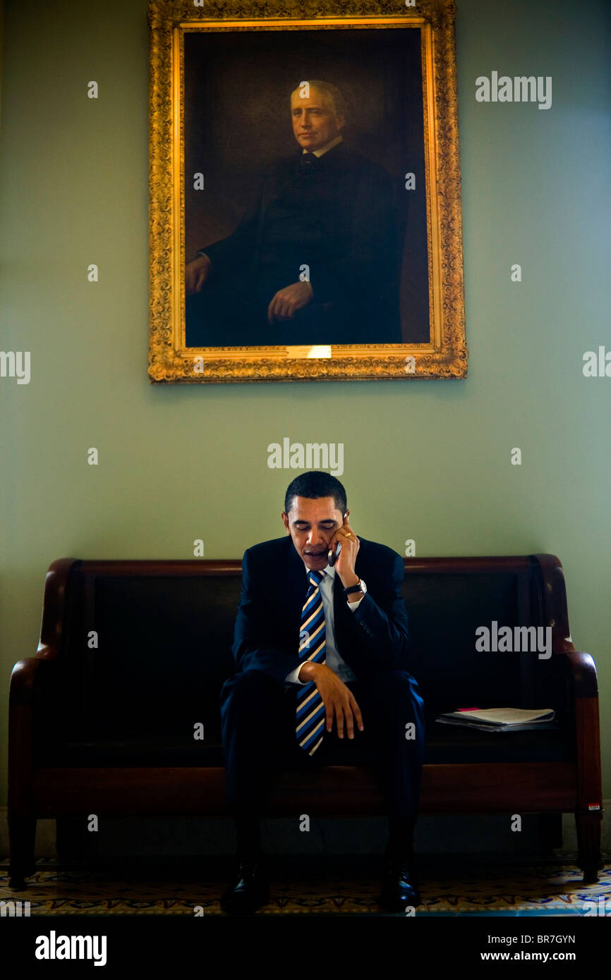 Barack Obama talks on a cell phone outside the Senate chambers of the U ...