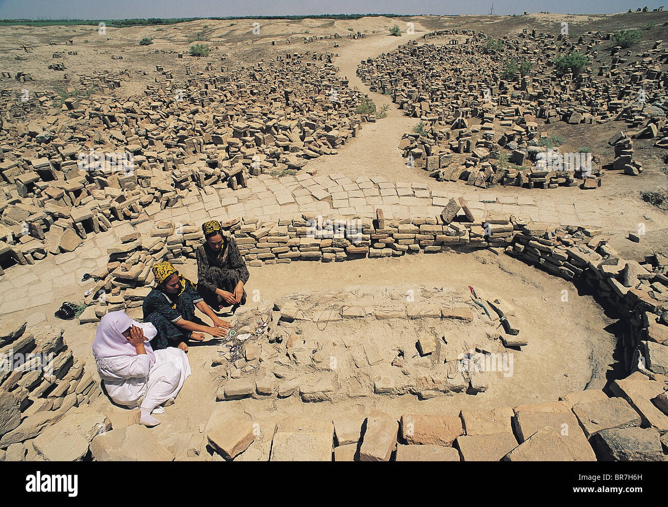 Women building wish stones and praying in evliya seyit cemalettin ...