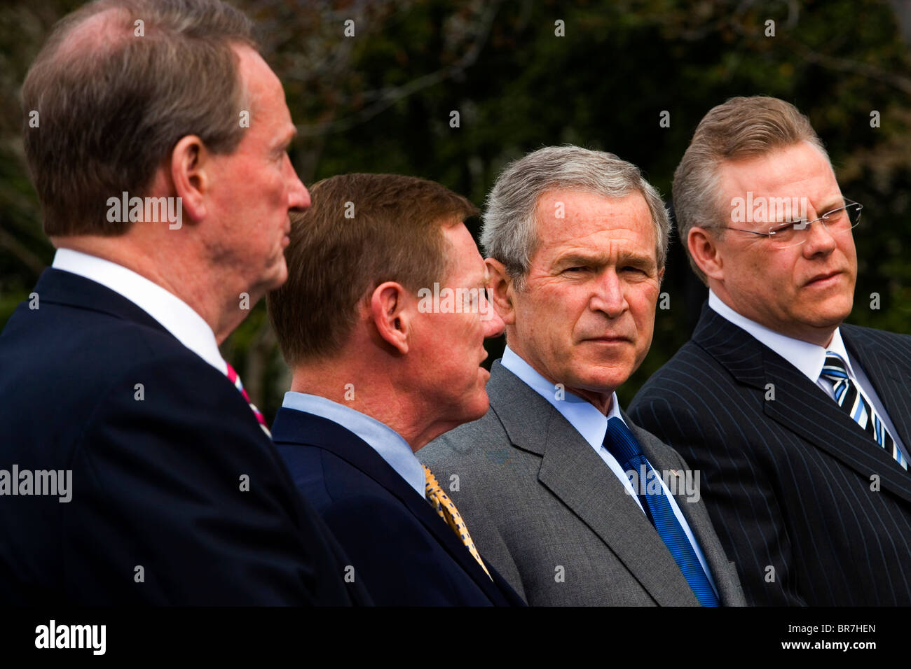 President Bush and the Big Three automakers take part in a photo-op ...