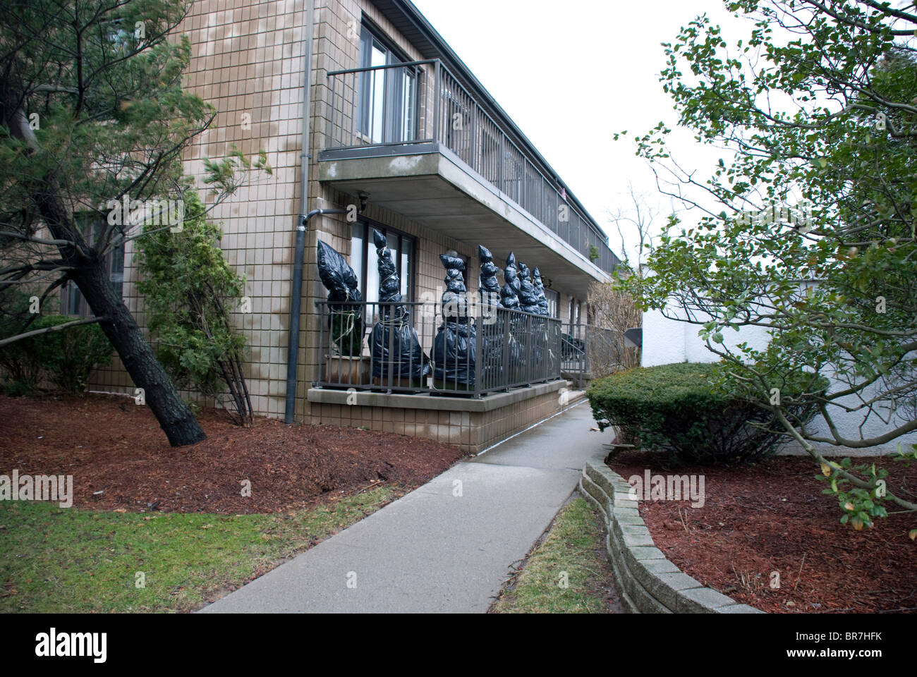 Troll like covered shrubs on balcony at apartment complex resembling ...