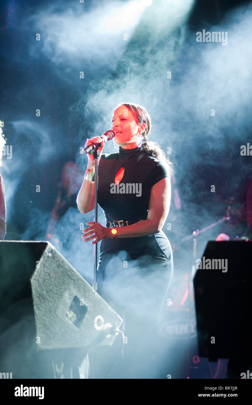 Woman singing at microphone Stock Photo - Alamy