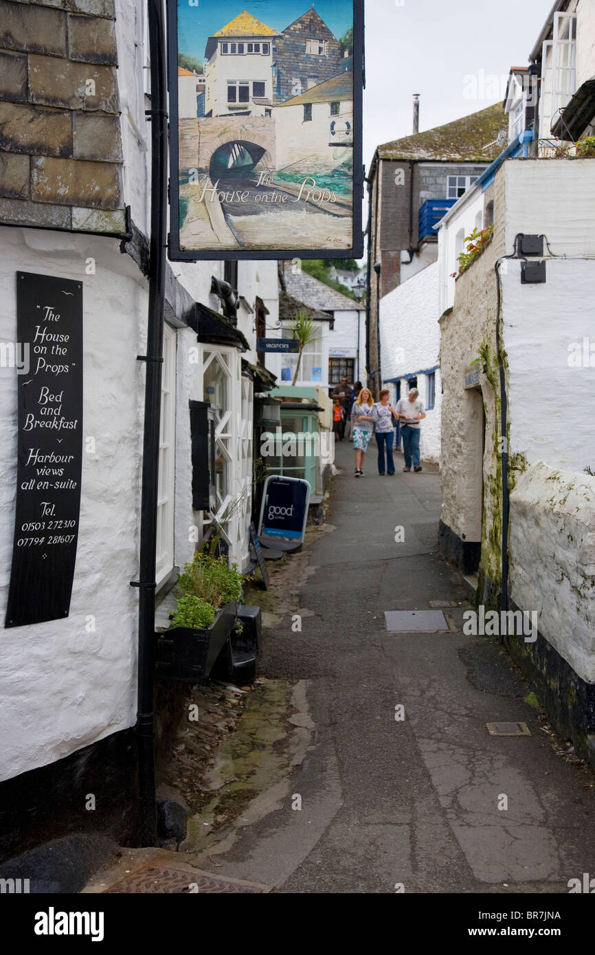 Tourists walking the narrow streets of the traditional Cornish fishing ...