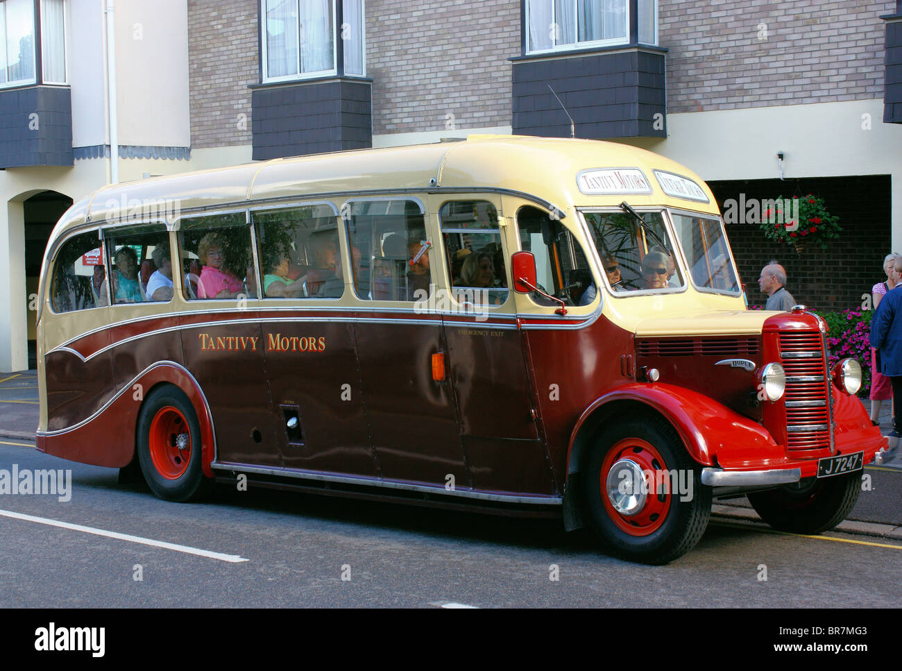 Senior Citizens outing on an equally senior bus, parked outside a hotel ...