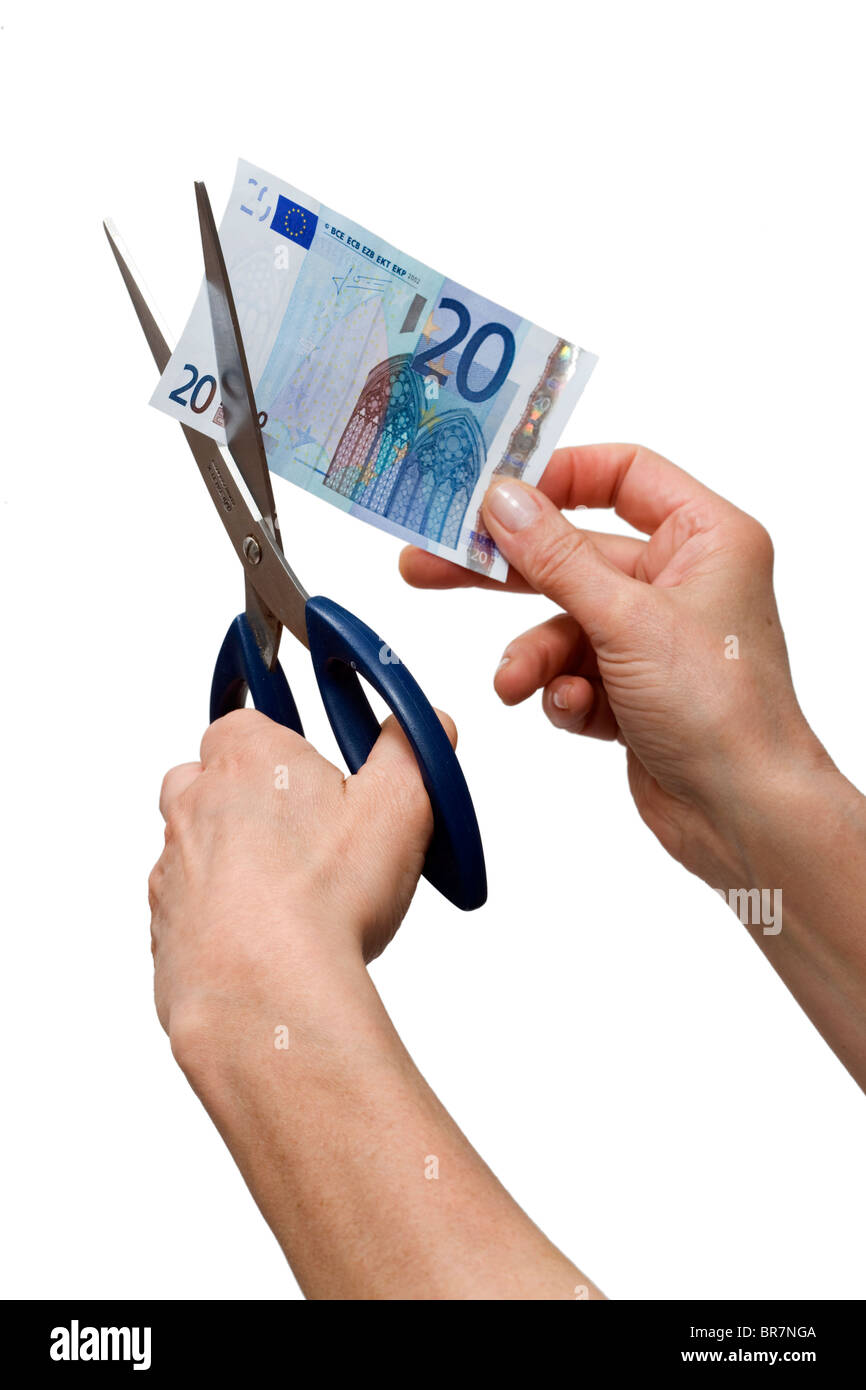 hands cutting one banknote with scissors Stock Photo - Alamy