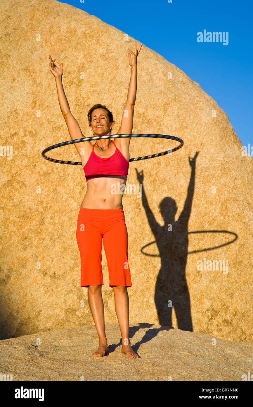 Hoop dancer performing in the California desert, on a summer afternoon ...