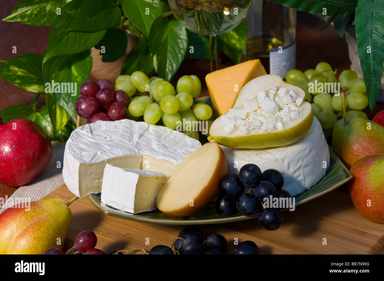 Cheese plate with grape and pear Stock Photo - Alamy