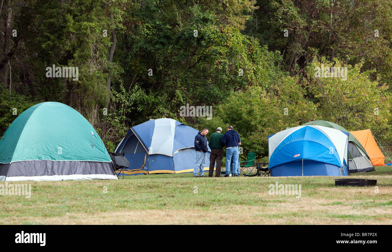 Tents and campers at a camp site in a clearing Stock Photo - Alamy