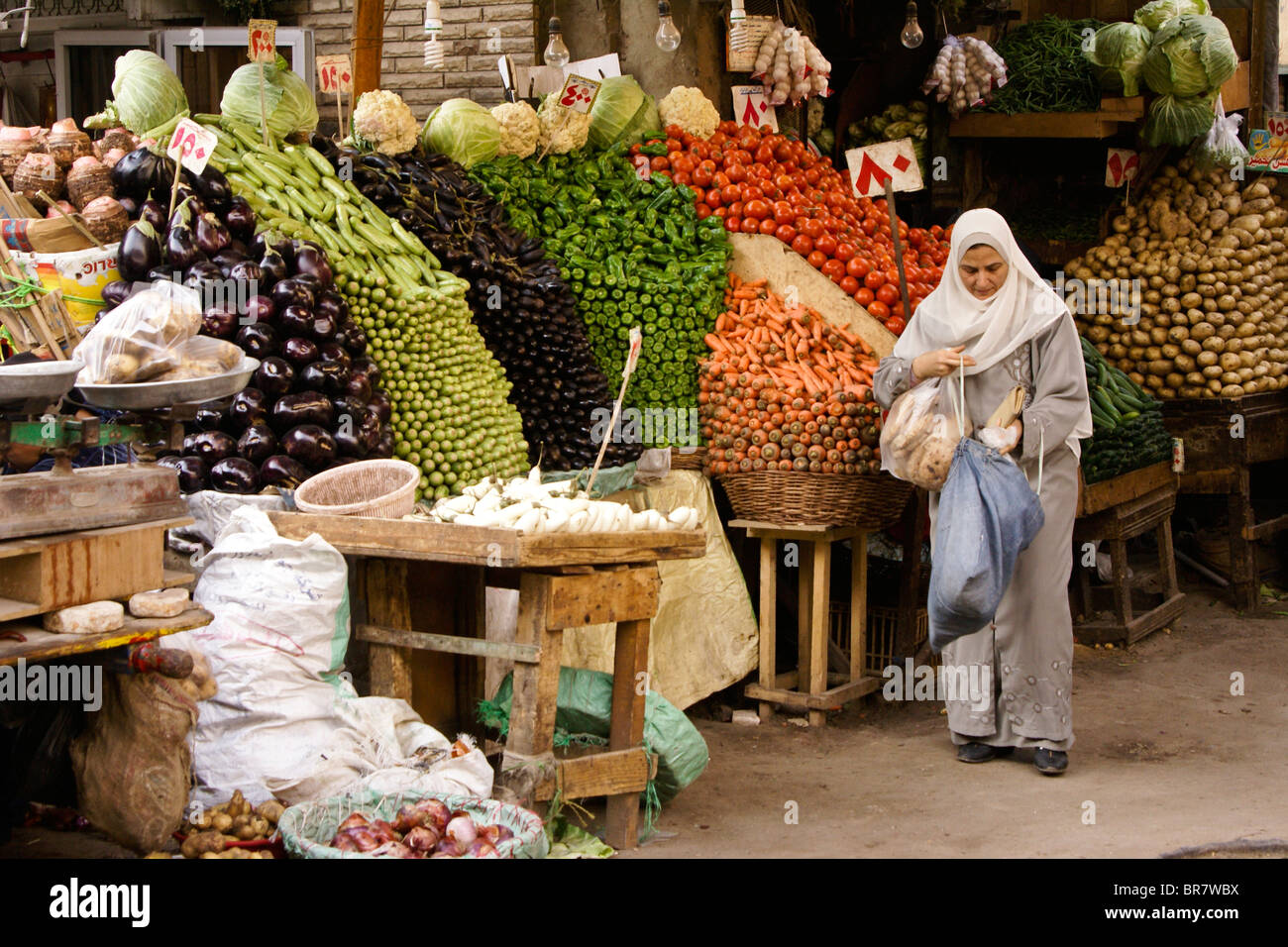 Muslim woman buying vegetables in market, Cairo, Egypt Stock Photo - Alamy