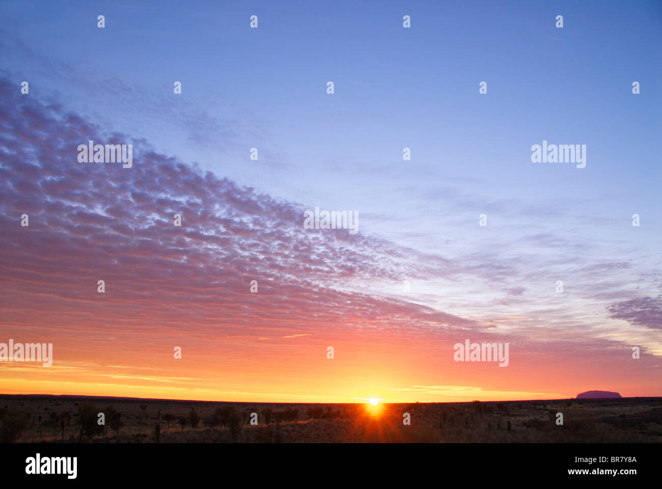 Uluru sun rise Stock Photo - Alamy