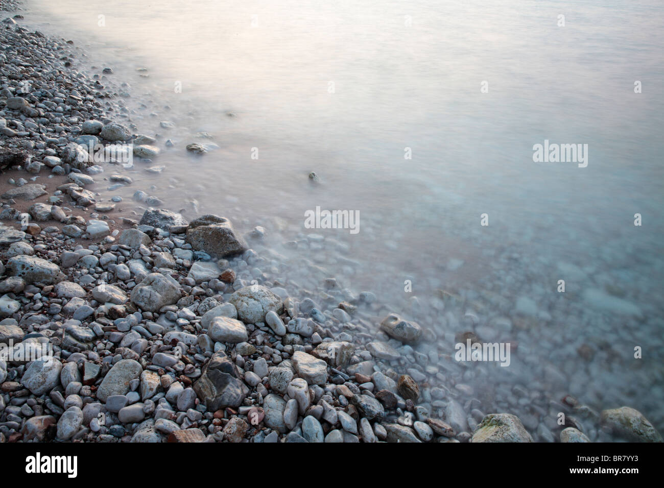 Pebbles on Beach Stock Photo - Alamy