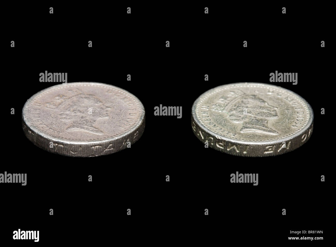 The obverse, or 'head's' side, of a fake British £1 coin (left) along ...