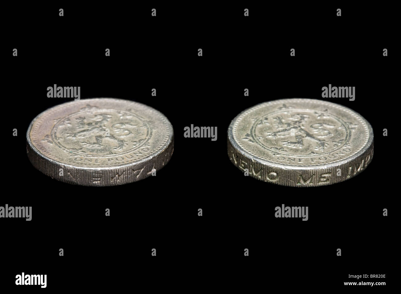 The reverse, or 'tail's' side, of a fake British £1 coin (left) along ...