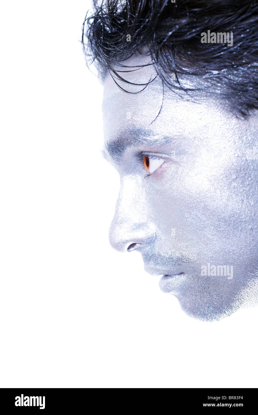 Profile of beautiful young guy with silver makeup isolated on white ...
