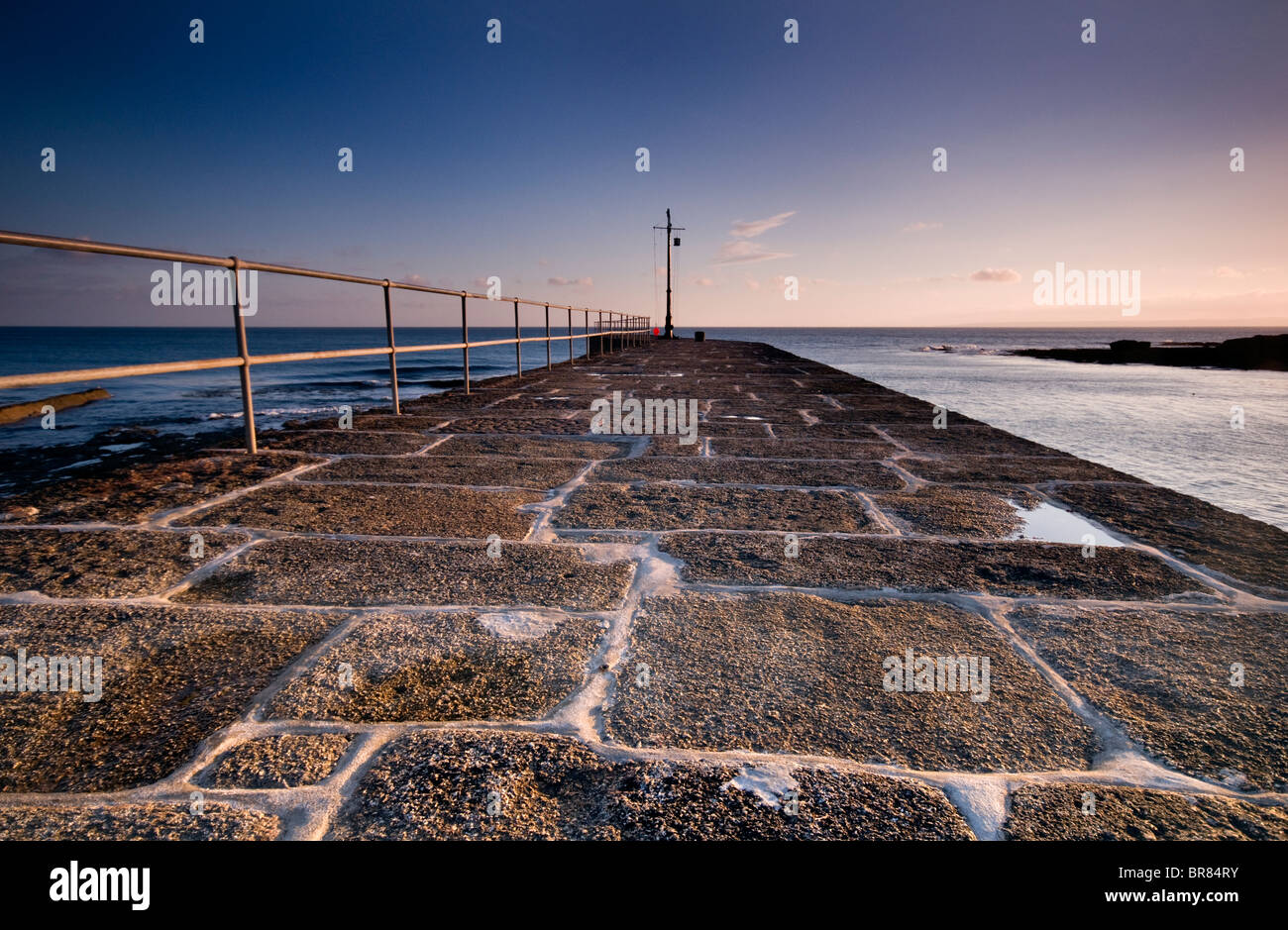 The stone jetty at Porthleven harbour in Cornwall, England, UK Stock ...