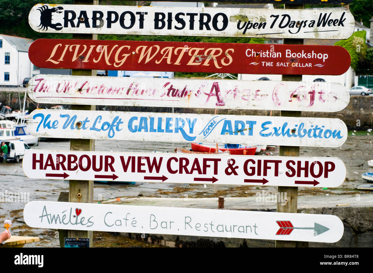 Signposts by the harbour at Porthleven in Cornwall, England, UK Stock ...
