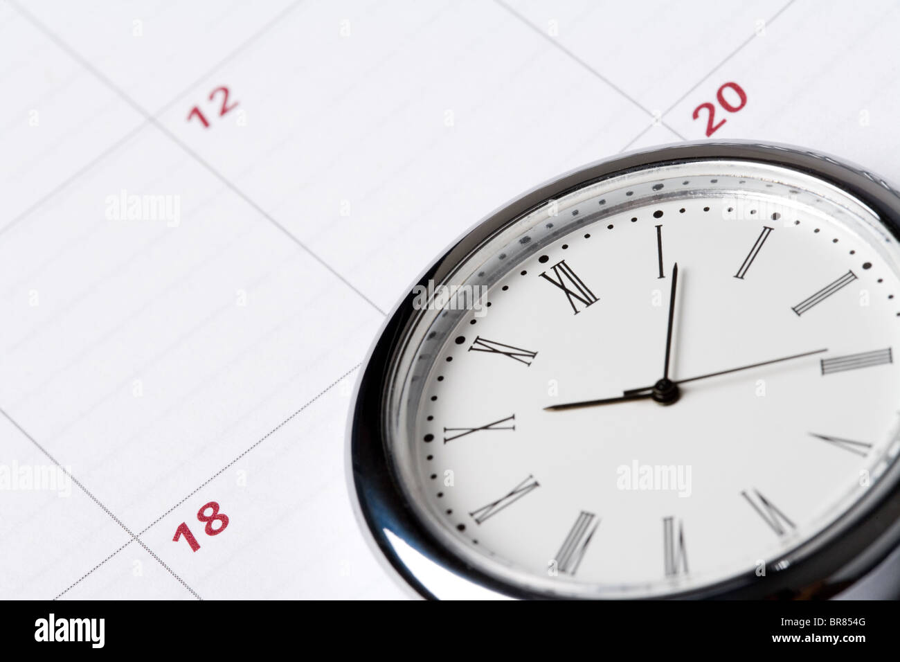 calendar and clock close up shot Stock Photo - Alamy
