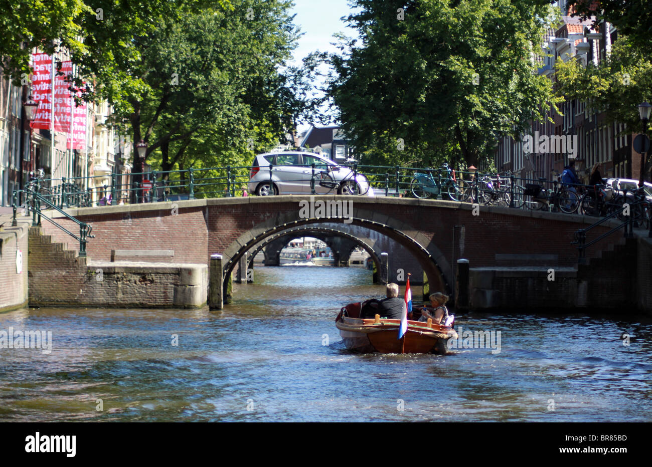 Canal Boats pretty bridge Amsterdam Stock Photo - Alamy