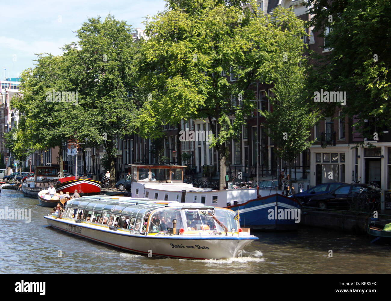 canal boat cruising on the Amsterdam canal, Holland, Netherlands Stock ...
