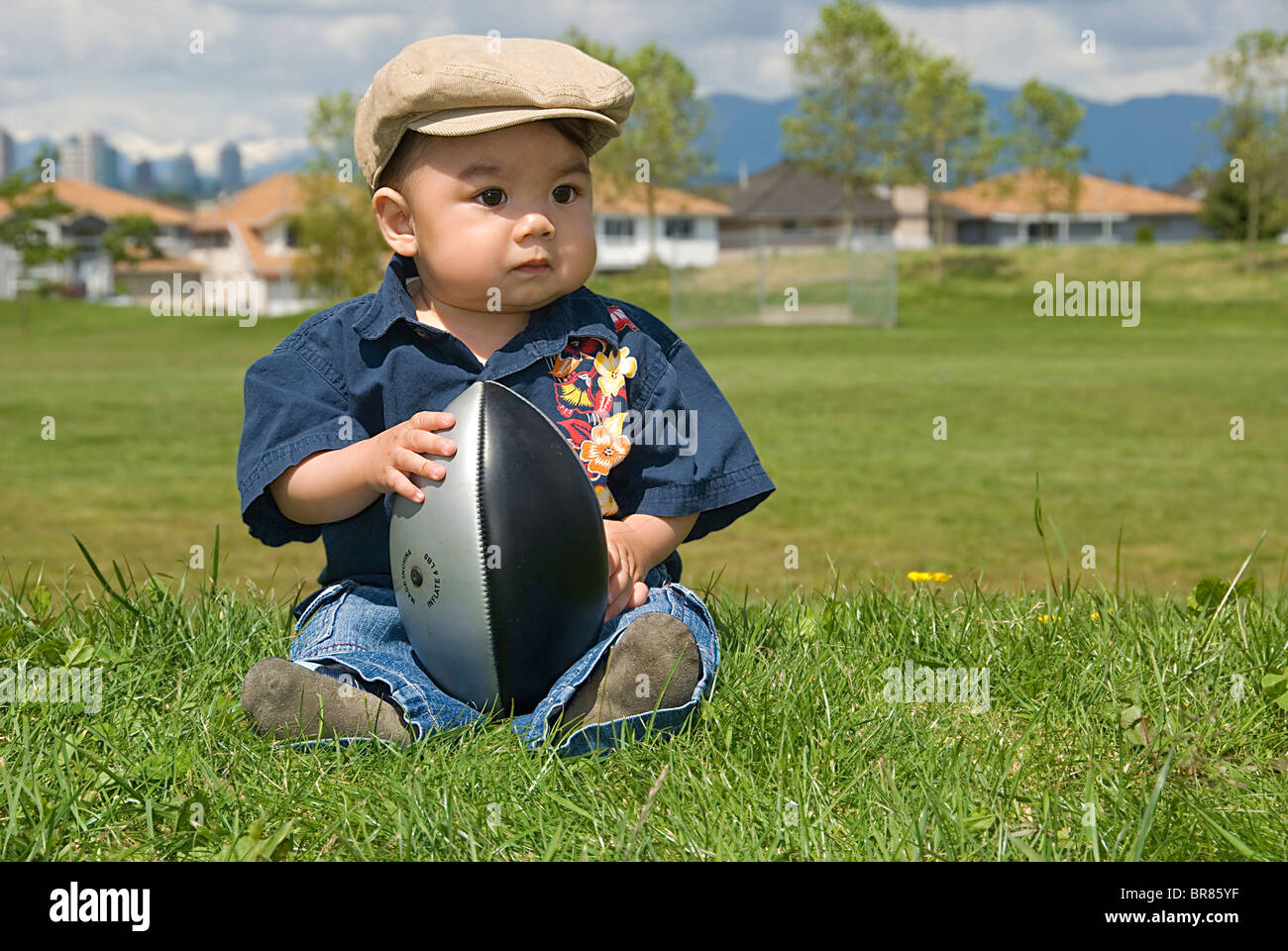 Baby boy with football Stock Photo - Alamy