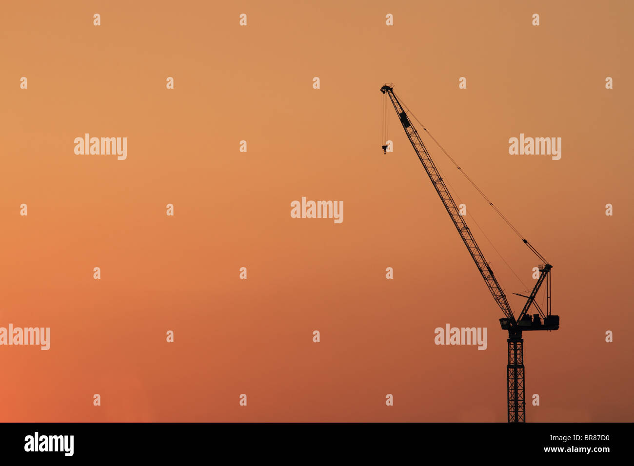 Construction crane at sunset Stock Photo - Alamy