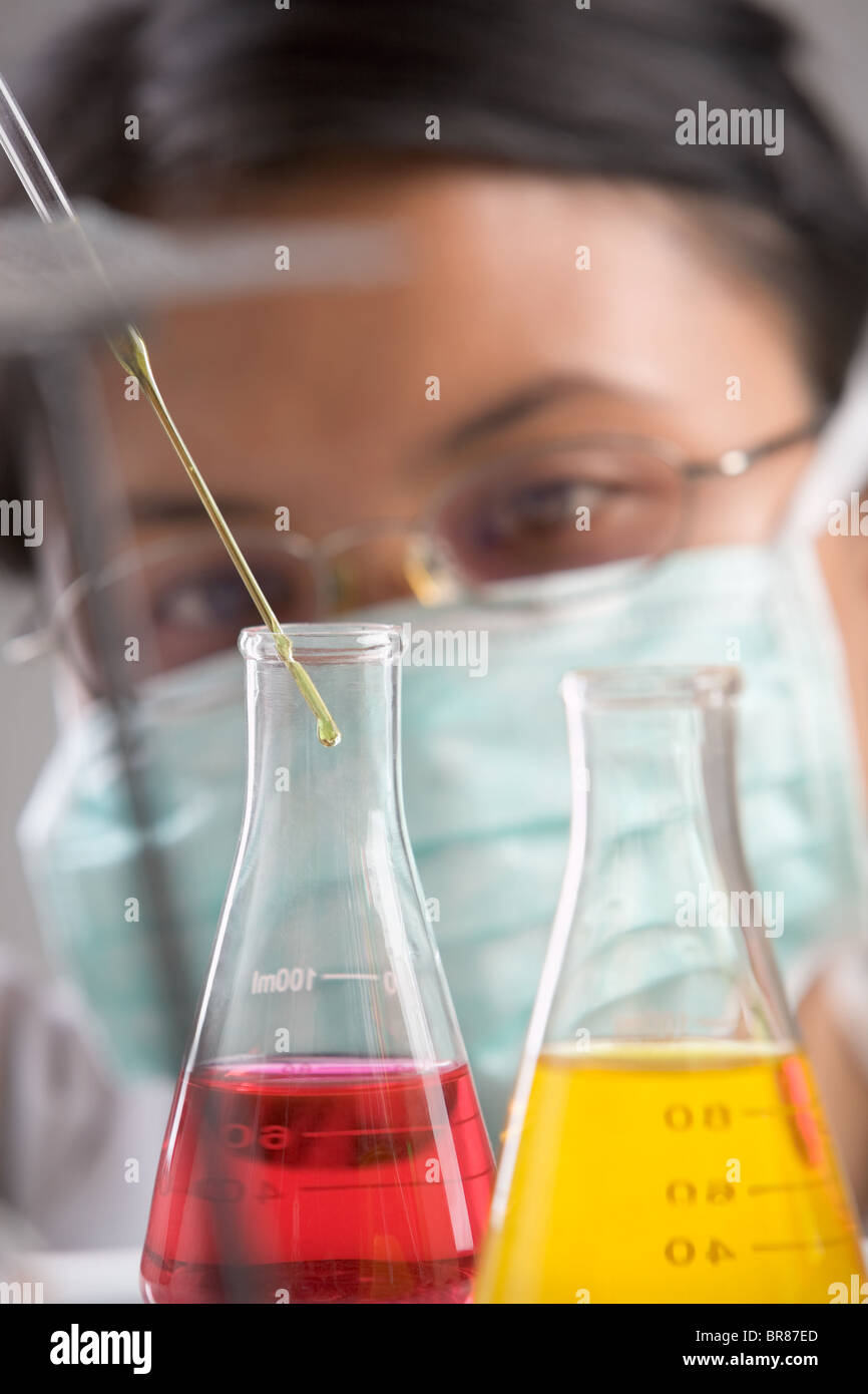 Female scientist mixing chemical solution hi-res stock photography and ...
