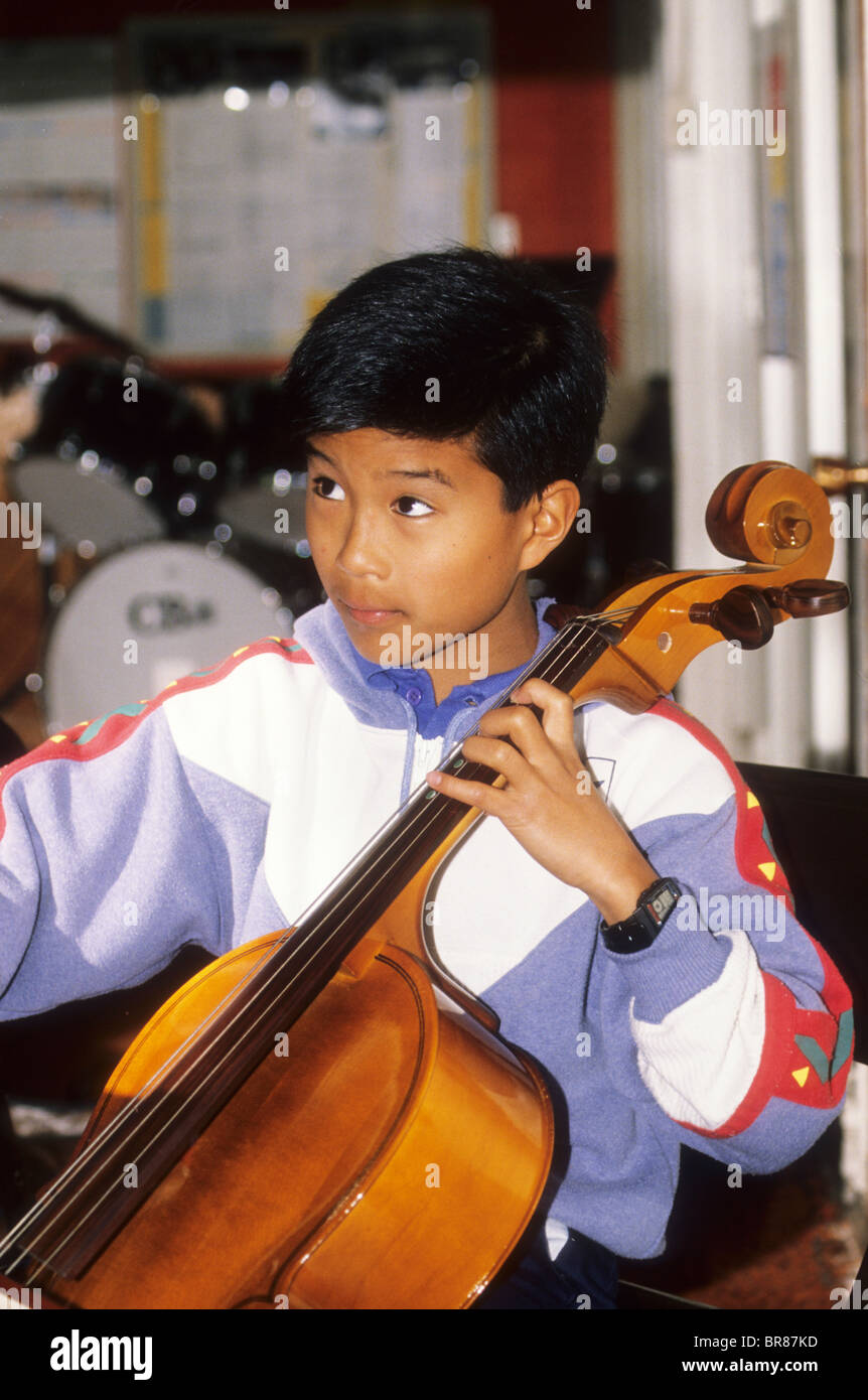 Asian boy play cello music orchestra school concert rehearse rehearsal ...