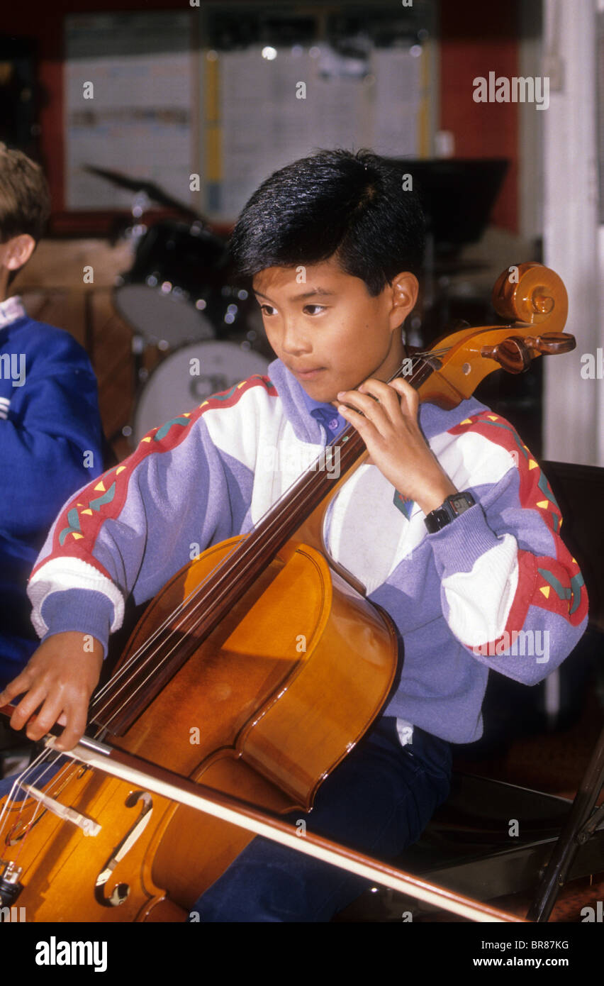 Asian boy play cello music orchestra school concert rehearse rehearsal ...