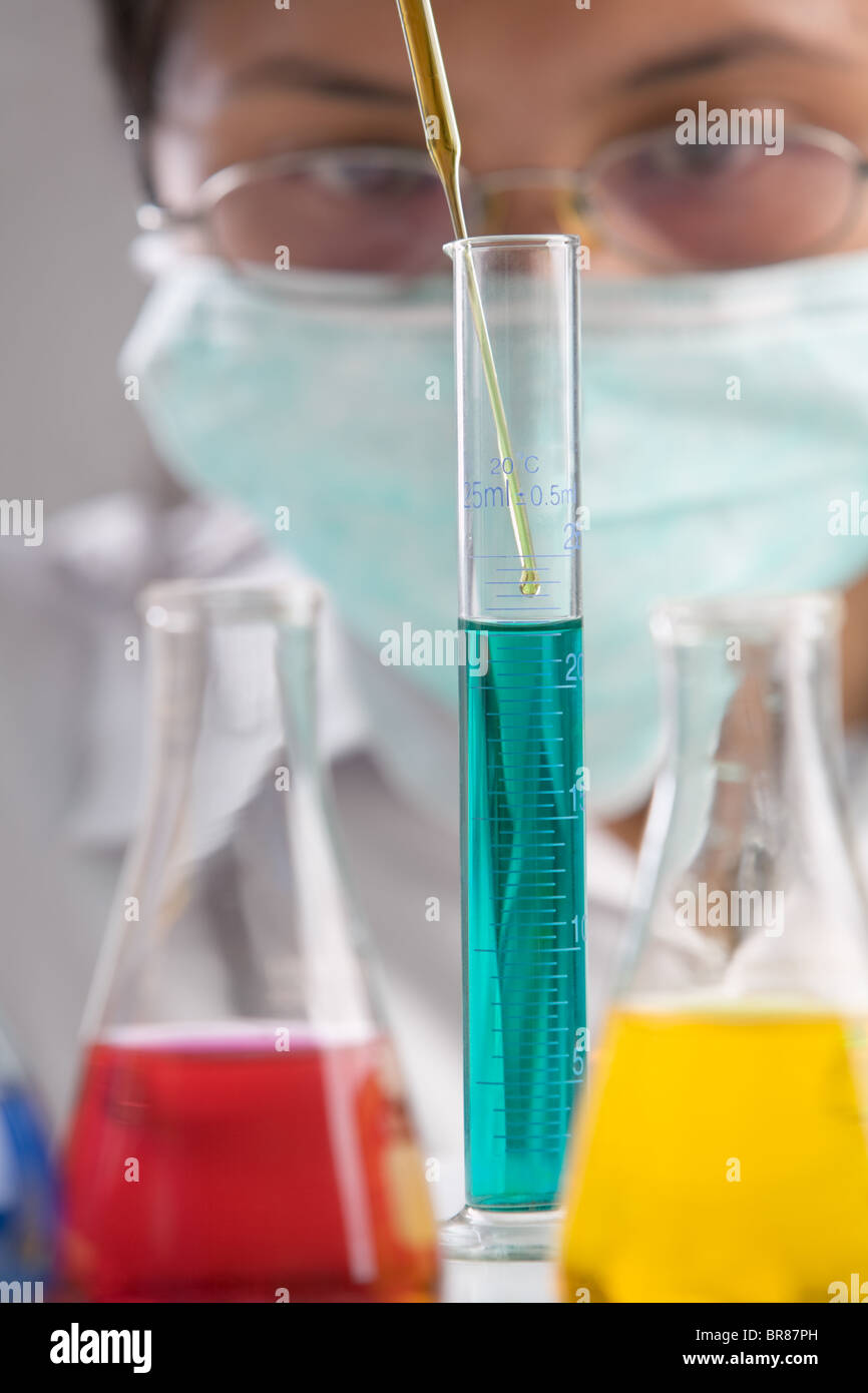 Female scientist mixing chemical solution hi-res stock photography and ...