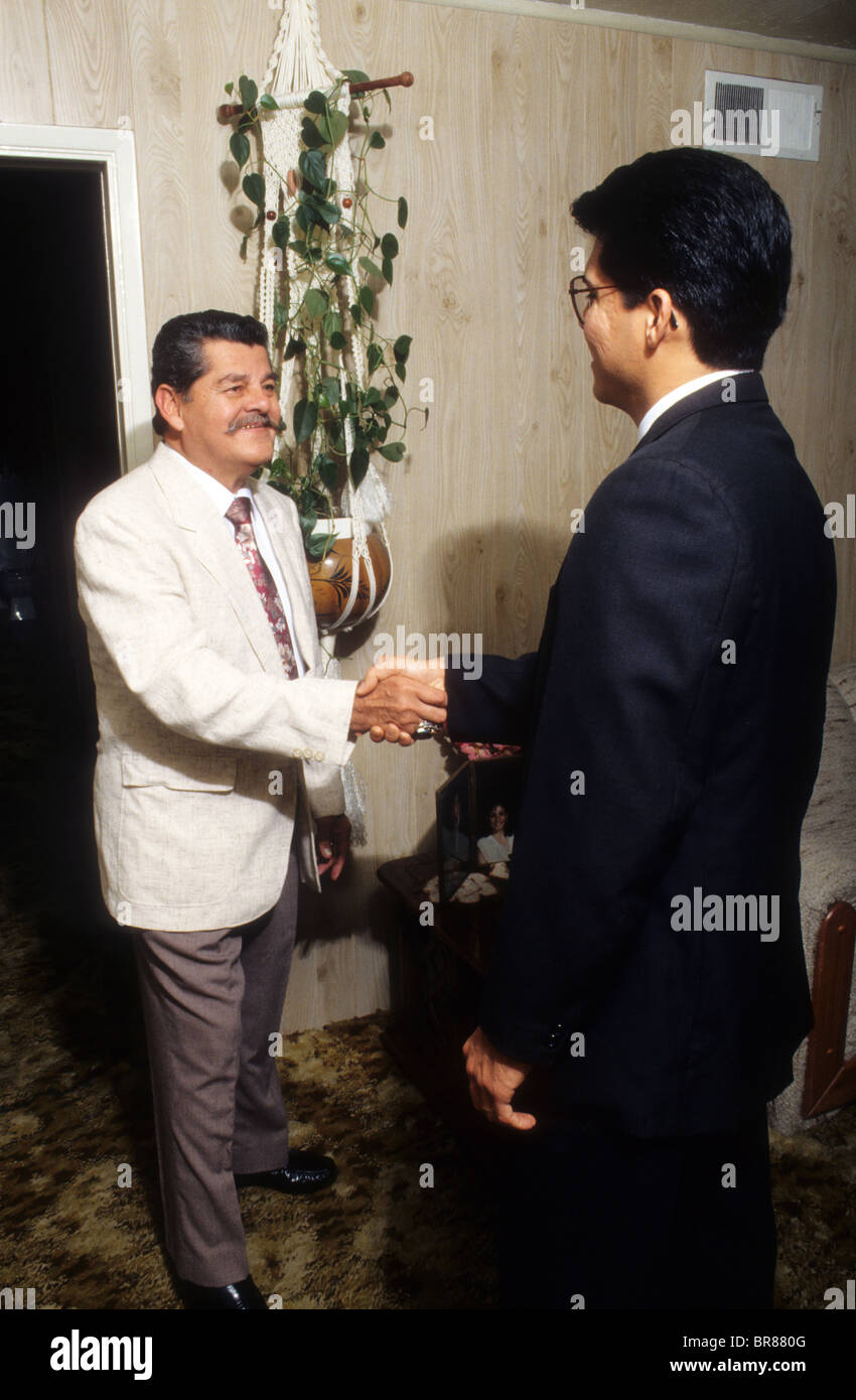 Hispanic men shake hands smile congratulate love respect honor father ...