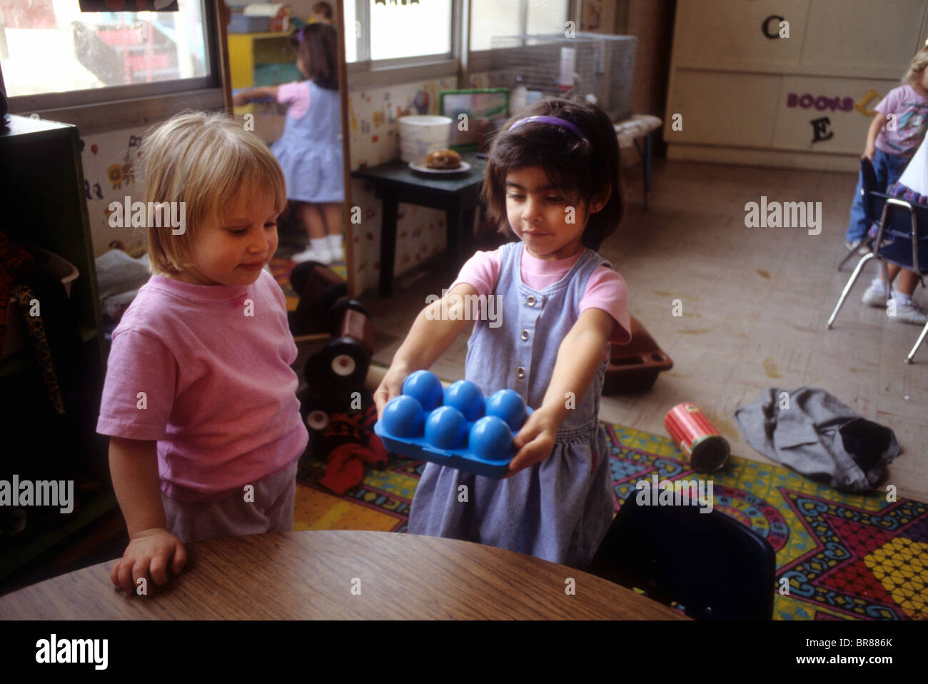 girl child pre-school kindergarten share play talk interact grow fun ...