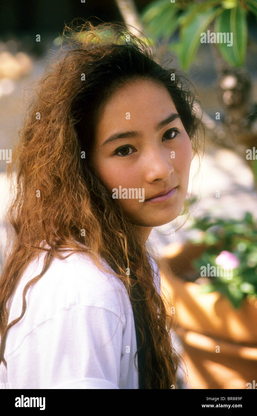 teen Asian girl serious face expression think thought decide decision ...