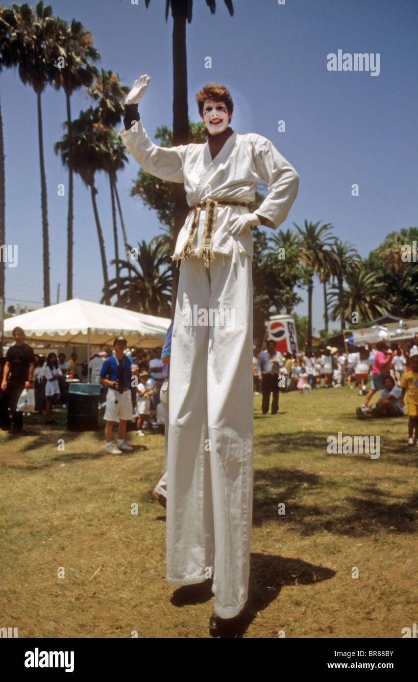 mime stilts tall carnival fun event fair perform thrill tall clown act ...