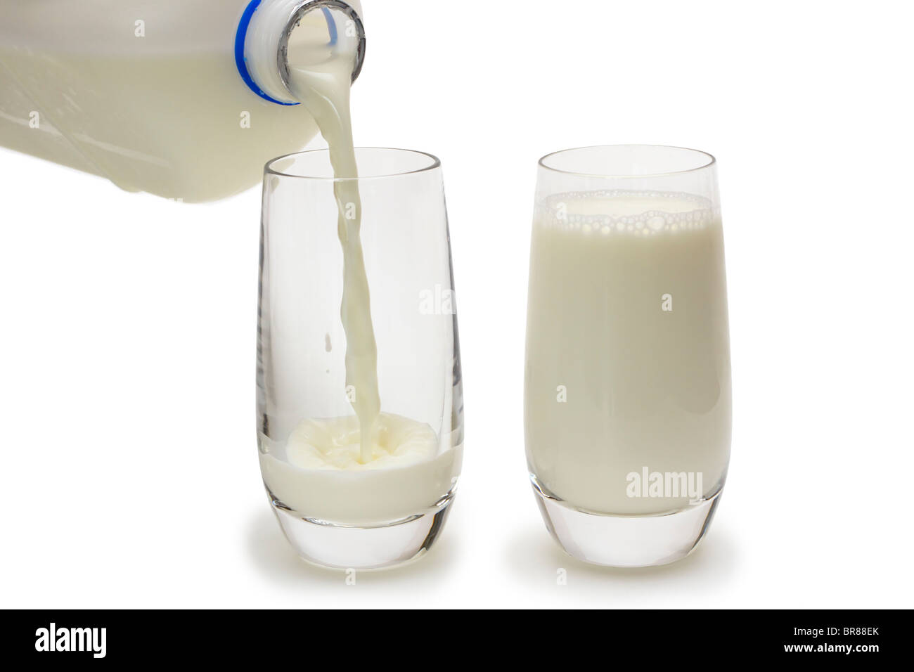 Pouring a glass of milk Stock Photo - Alamy