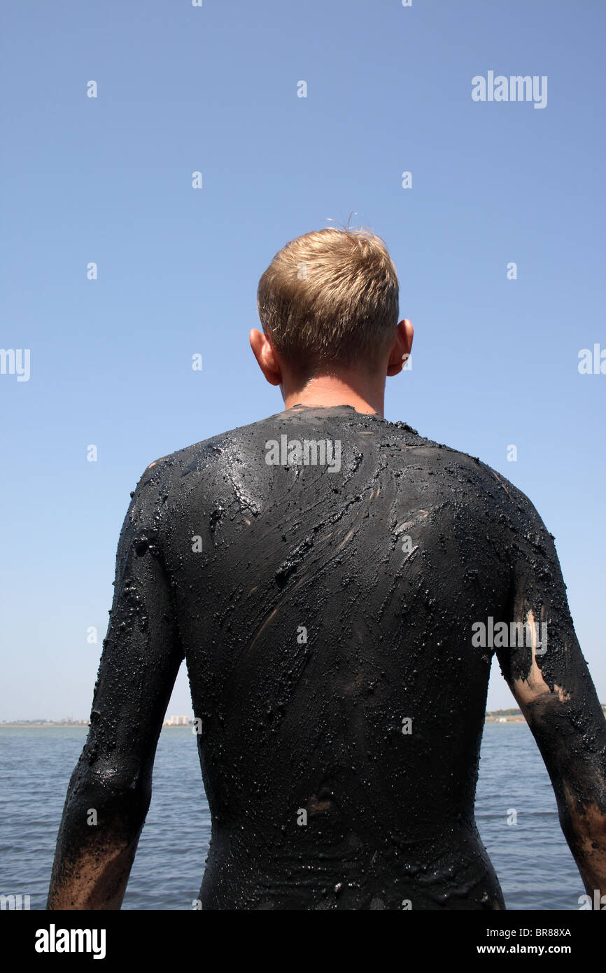 Young man covered in mud hi-res stock photography and images - Alamy