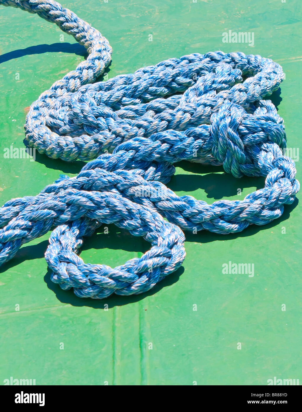 Untied blue rope on ship's deck Stock Photo - Alamy
