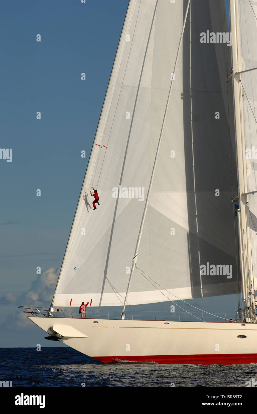 Crew member hoisted up the massive foresail of 180ft Superyacht "Adele ...