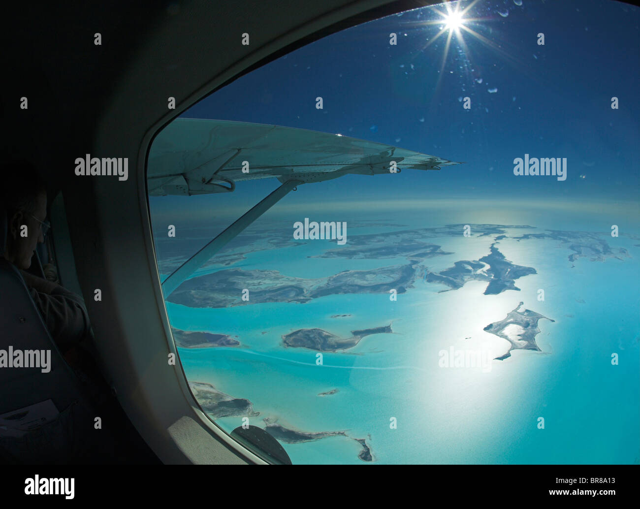 Aerial view through the window of a plane of the islands of Exuma, part ...