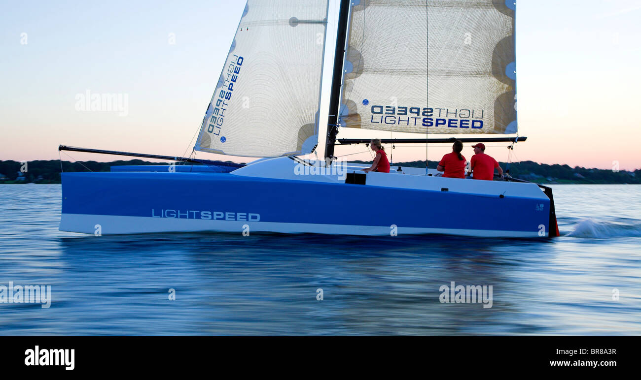 Lightspeed 32 cruising catamaran sailing at sunset Stock Photo - Alamy