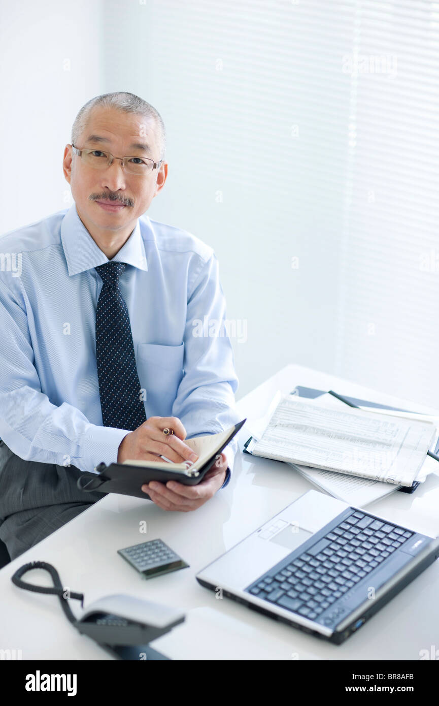 Portrait businessman office desk hi-res stock photography and images ...