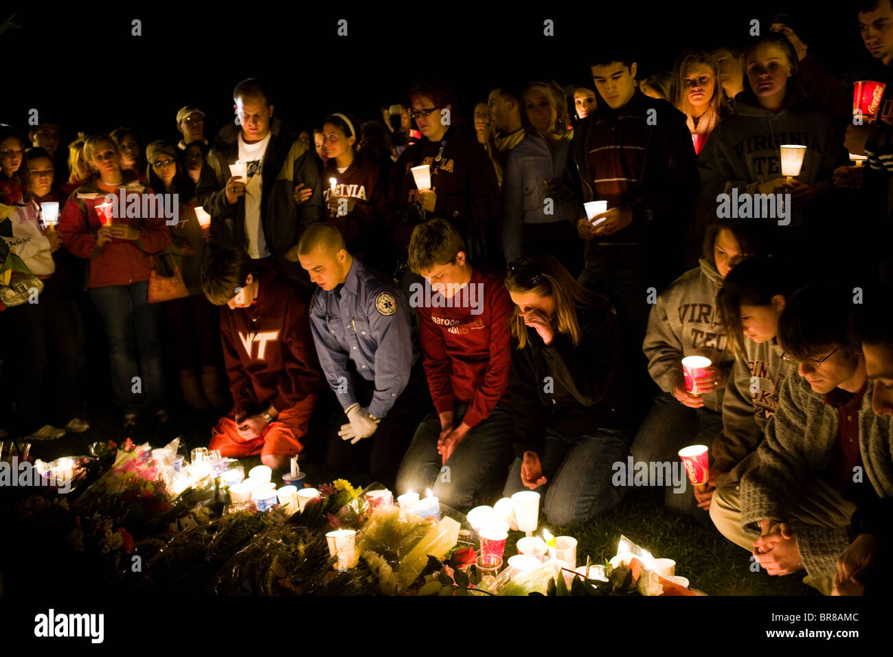 Scenes from a candle light vigil on the campus of Virginia Tech sight ...