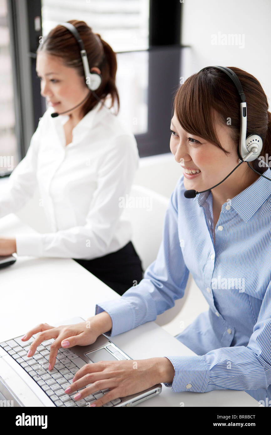Customer service representatives with headset Stock Photo - Alamy