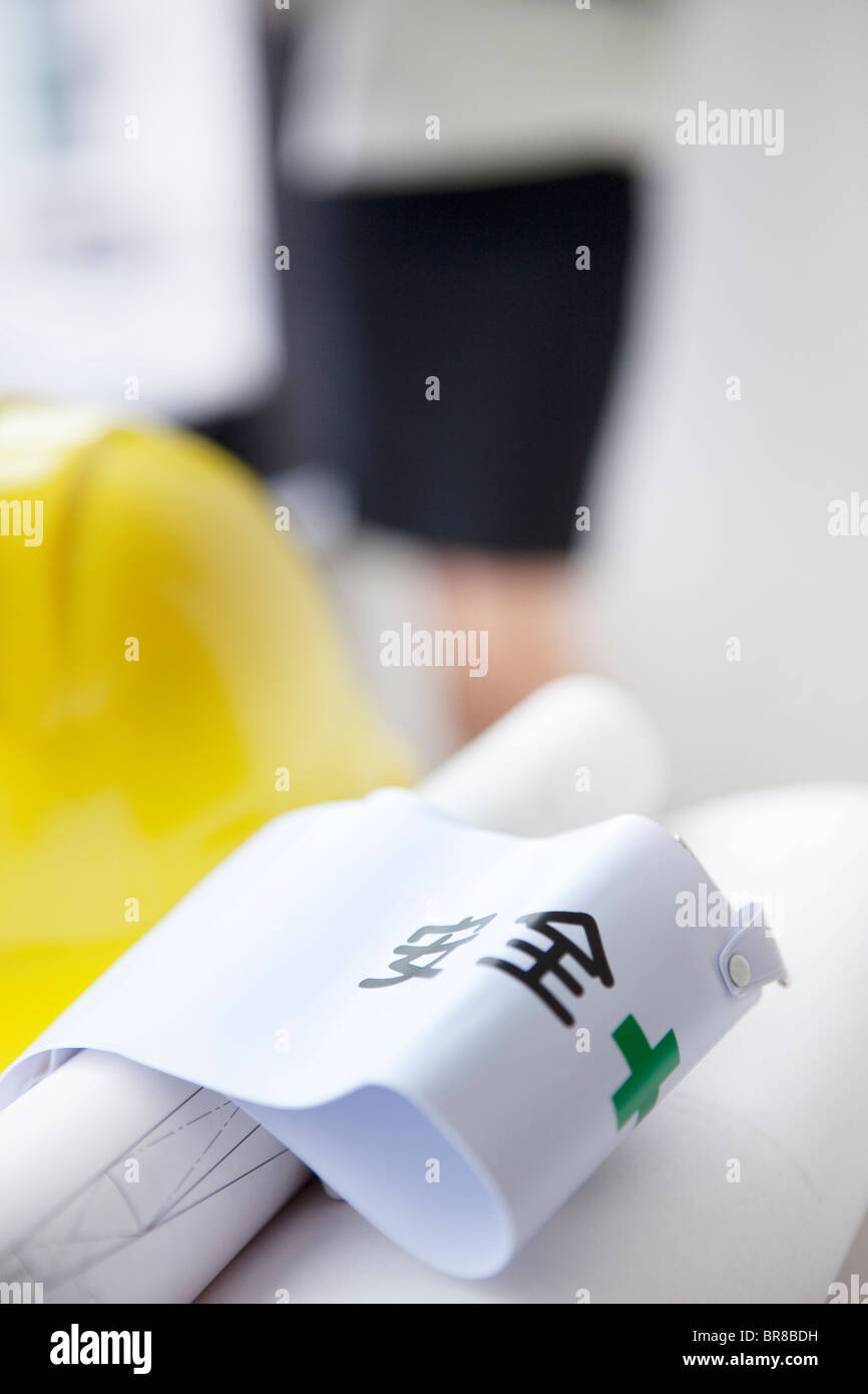 Safety arm band and blueprint Stock Photo - Alamy