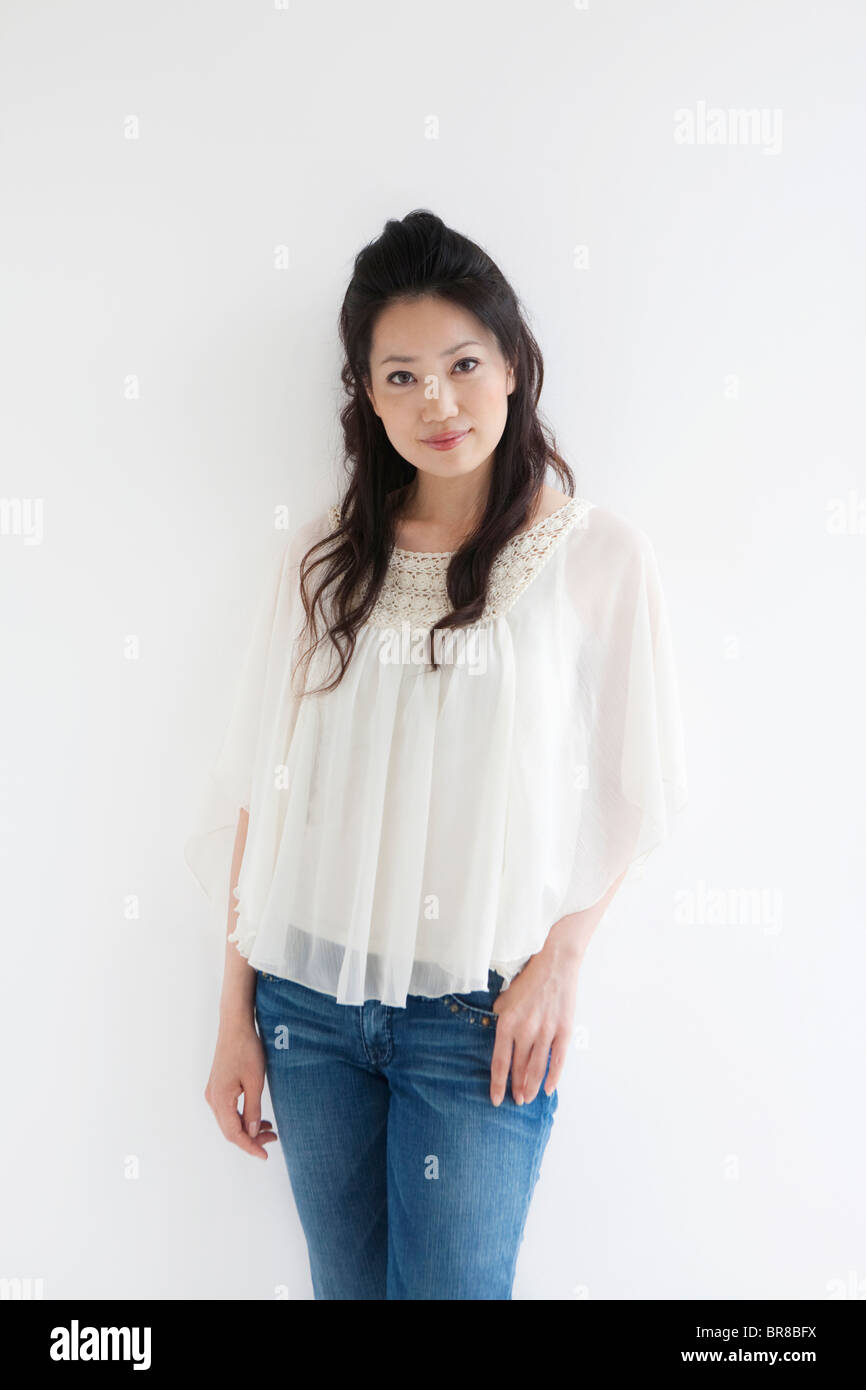 Portrait of woman standing Stock Photo - Alamy