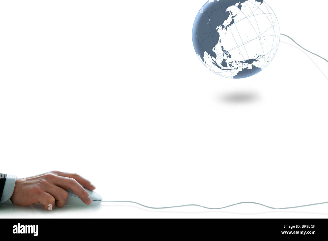 Businessman using computer mouse connected to globe Stock Photo - Alamy