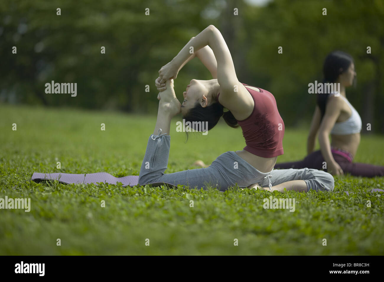 Two Young Stretching Stock Photo - Alamy