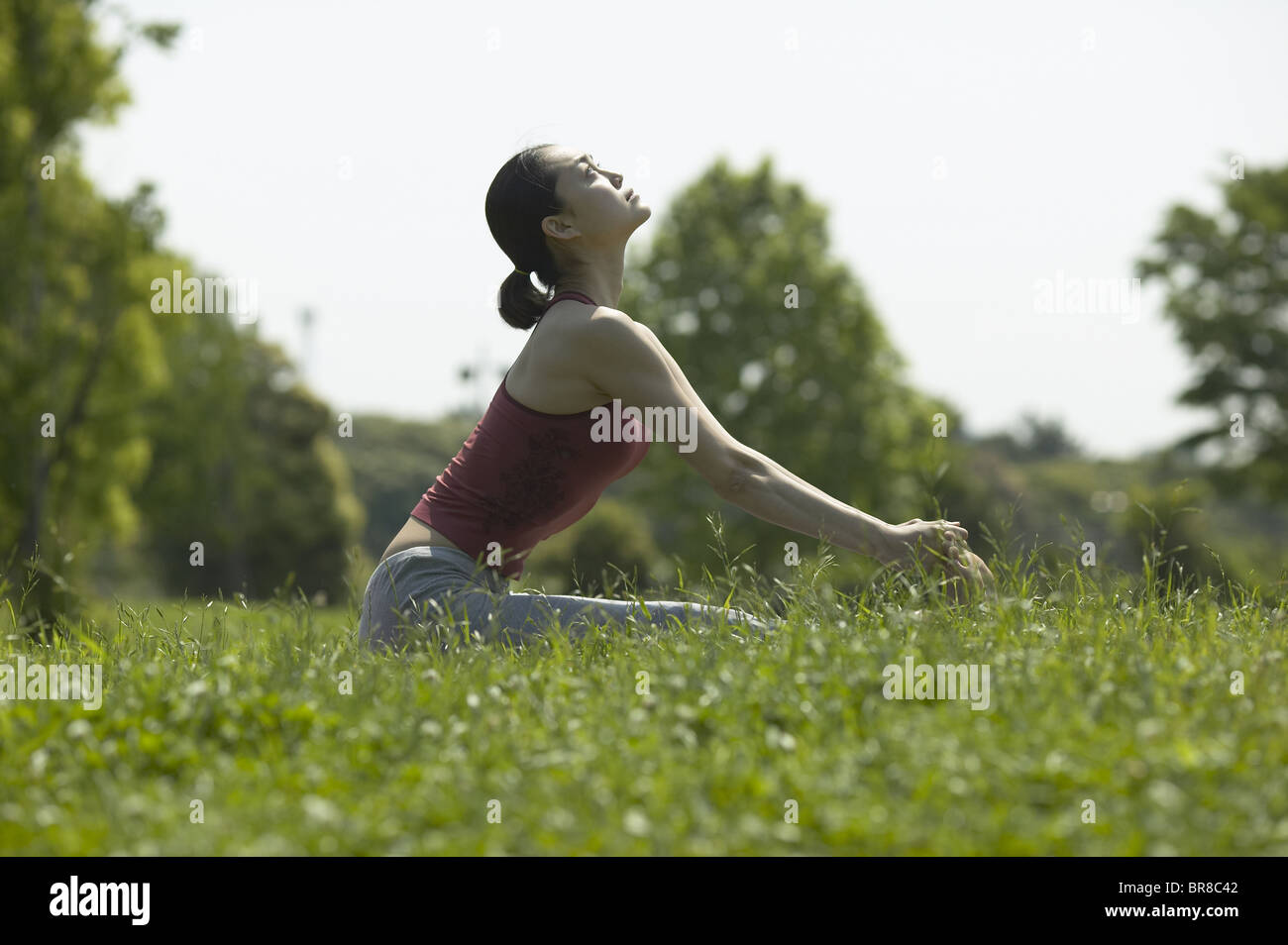 Side view young woman stretching hi-res stock photography and images ...