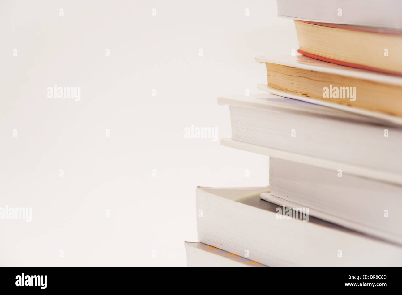 Stack of books over a white background Stock Photo - Alamy