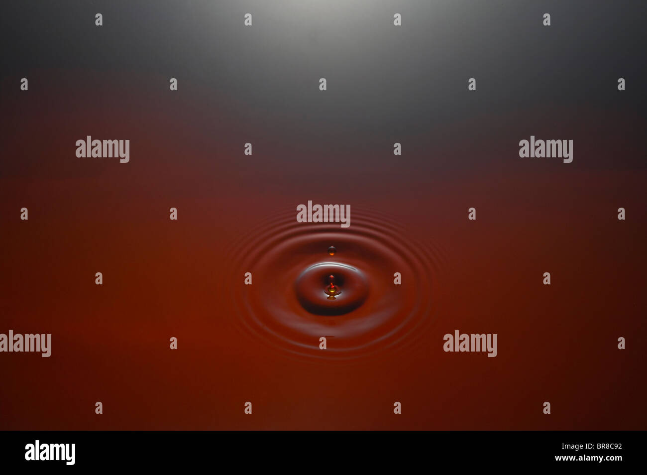 Ripple in red wine Stock Photo - Alamy